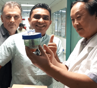 Dr. Pancholi speaking at Indie Bio Demo Admiring MiniTC Dr. Guarino